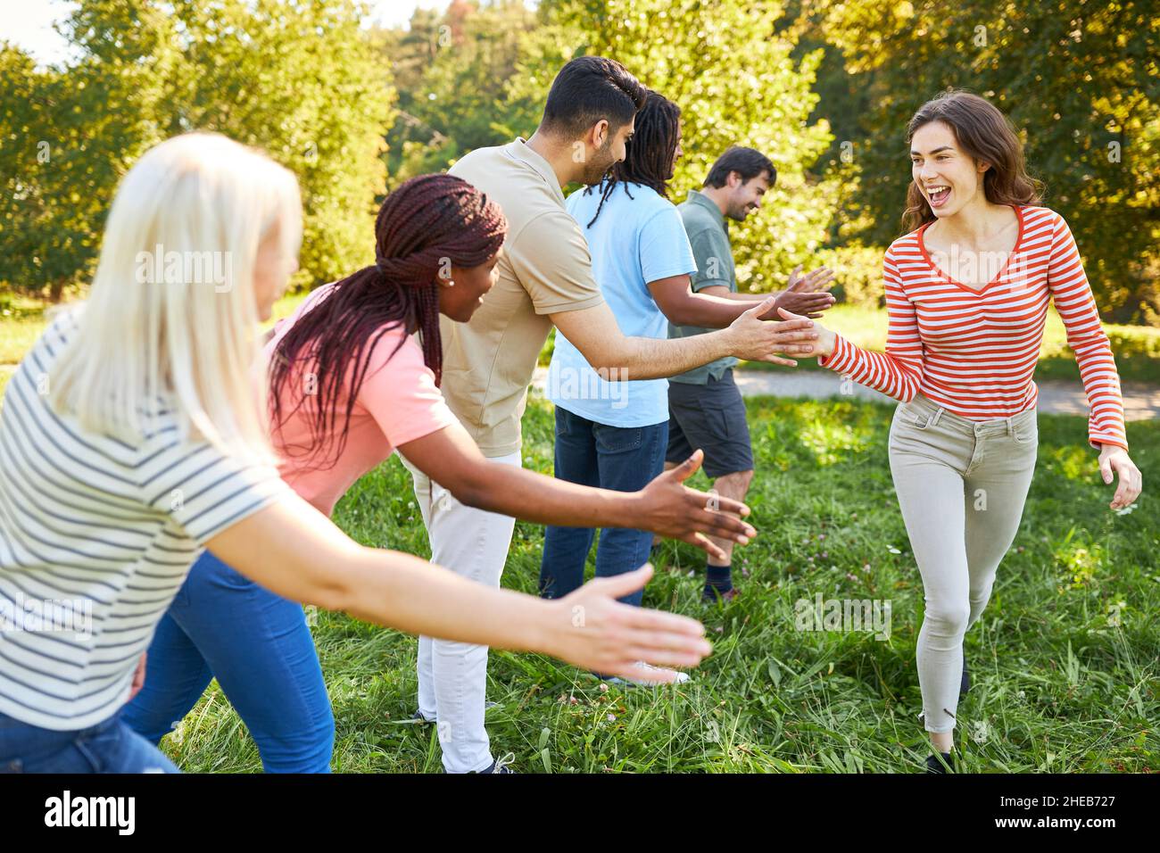 Young people in the startup team clapping in the team building workshop ...