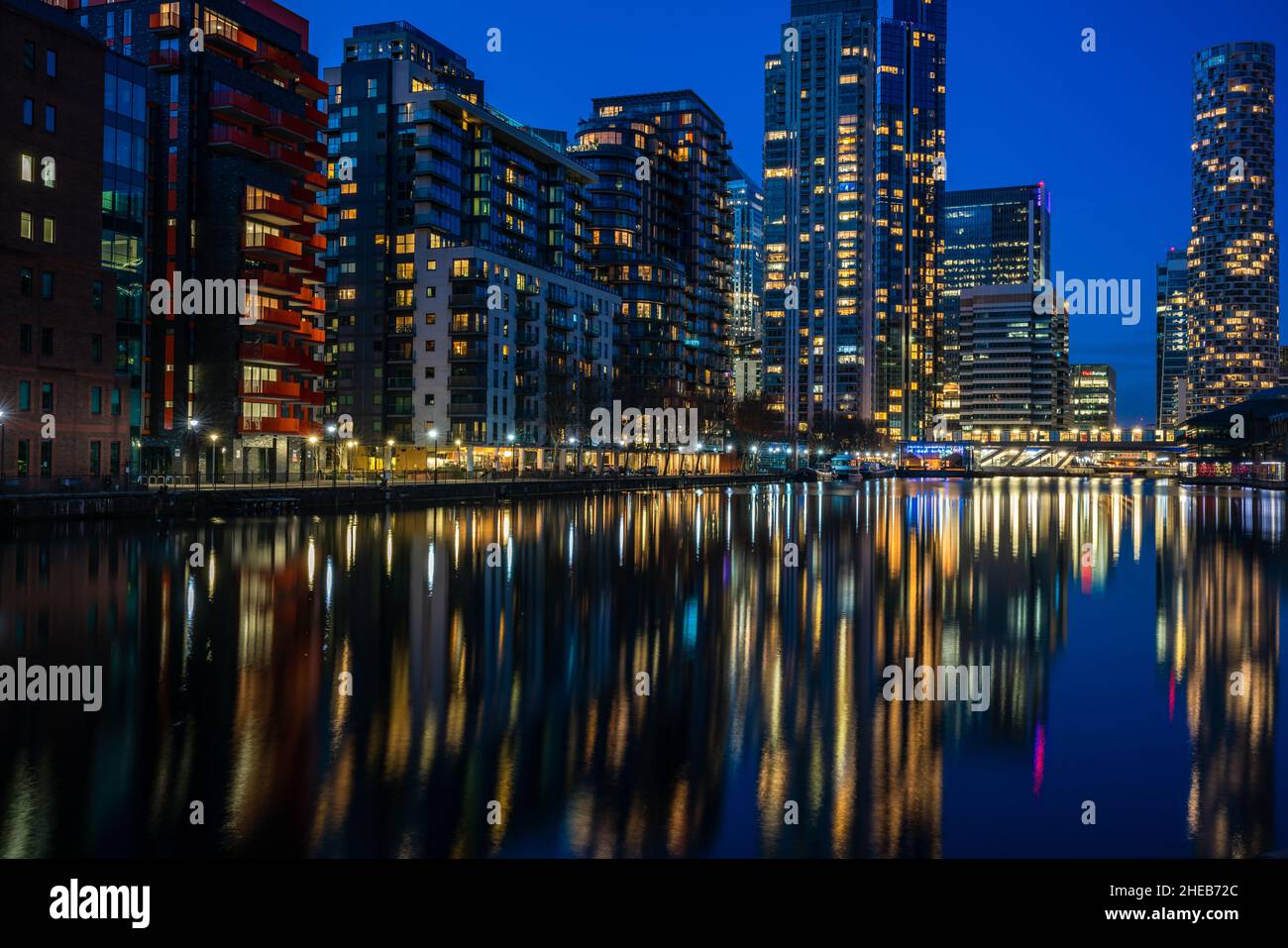 Evening view of modern skyscrapers across Millwall Inner Dock in Canary ...