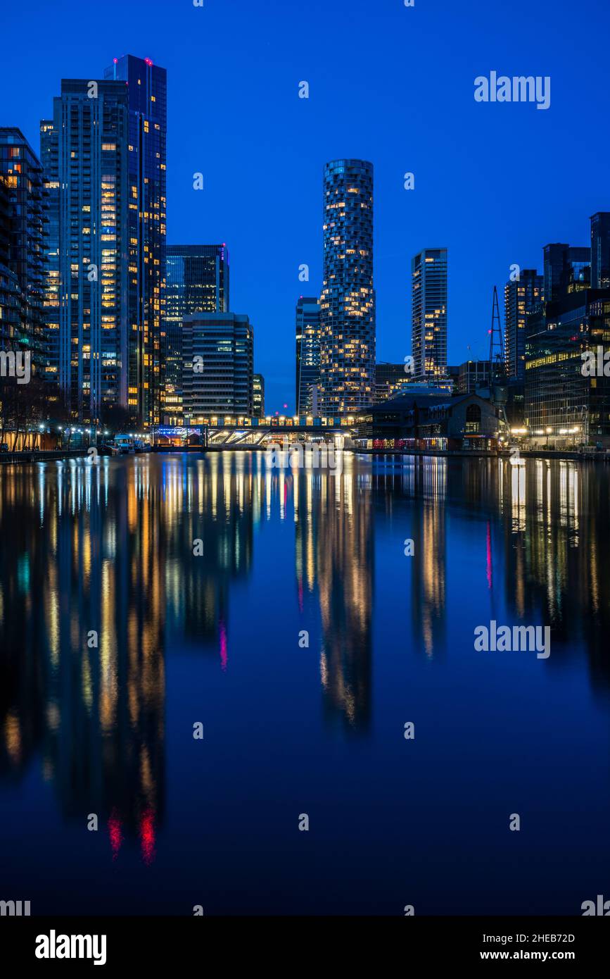 Evening view of modern skyscrapers across Millwall Inner Dock in Canary ...