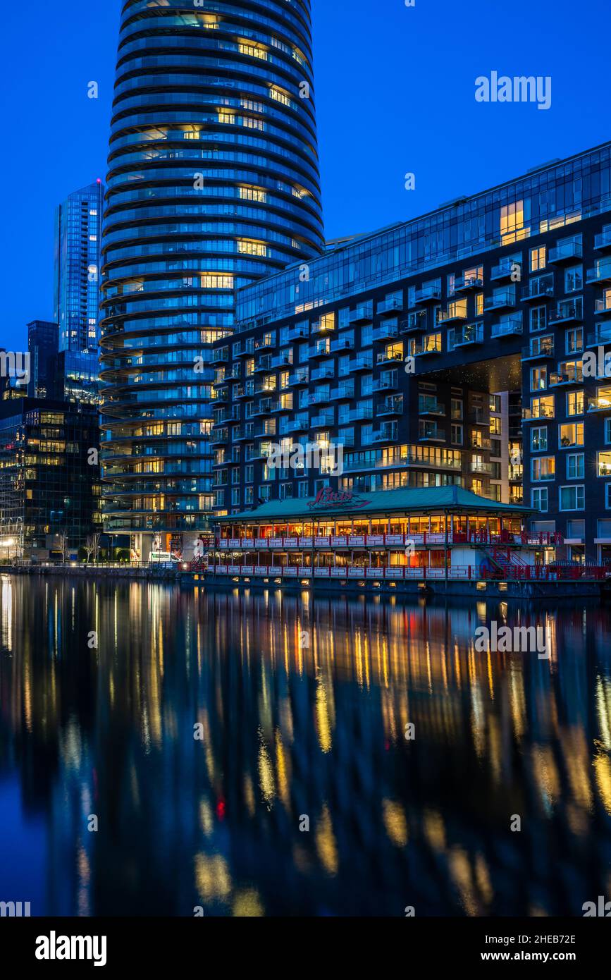 Evening view of modern skyscrapers across Millwall Inner Dock in Canary ...