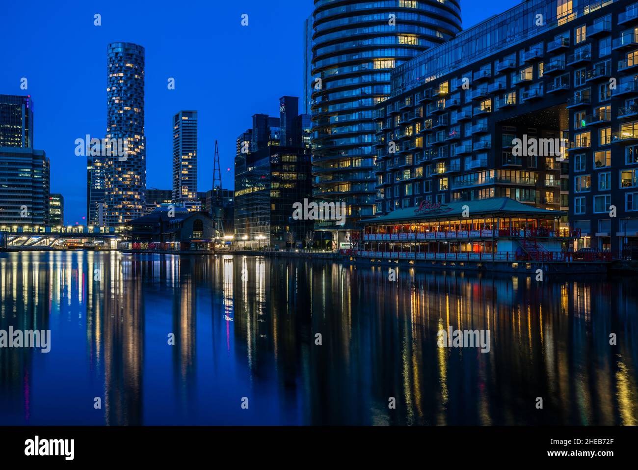 Evening view of modern skyscrapers across Millwall Inner Dock in Canary ...