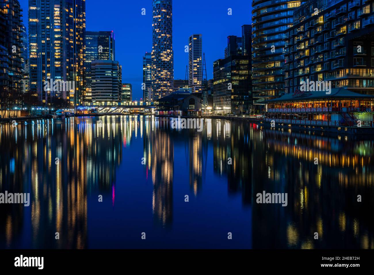 Evening view of modern skyscrapers across Millwall Inner Dock in Canary ...