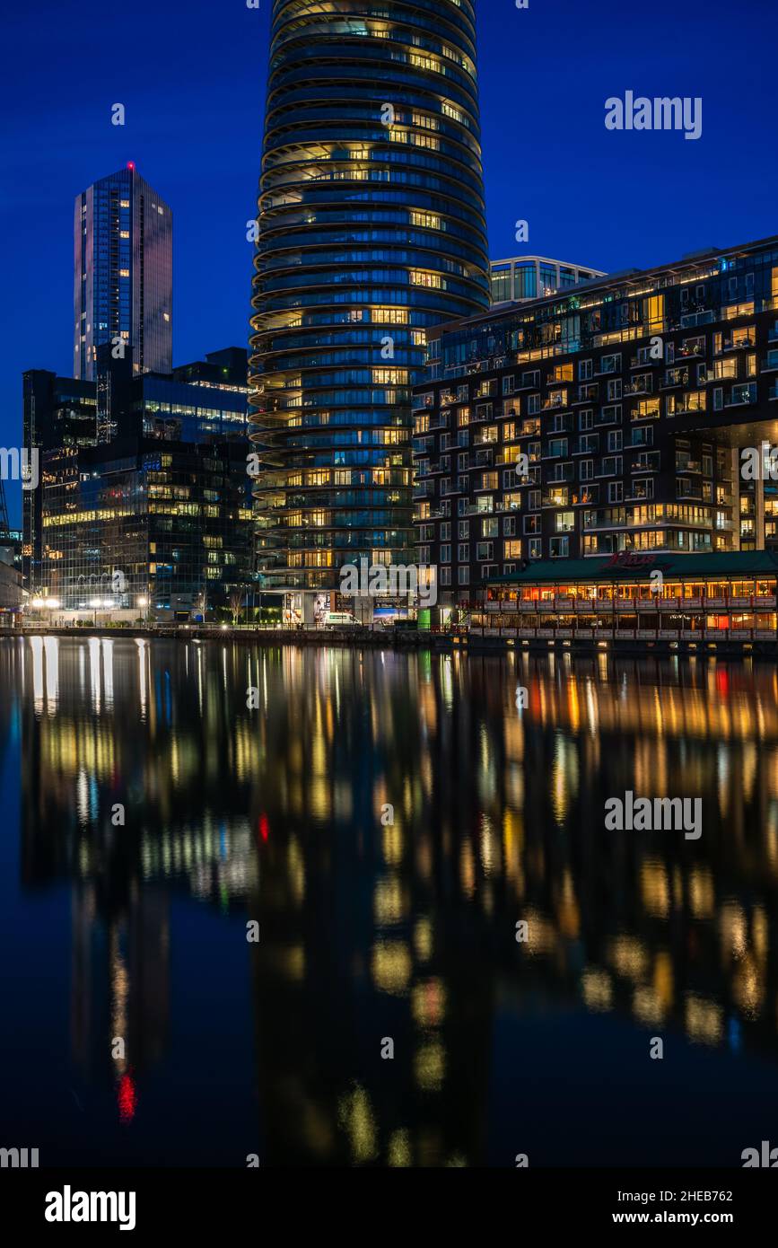 Night view of modern skyscrapers across Millwall Inner Dock in Canary ...