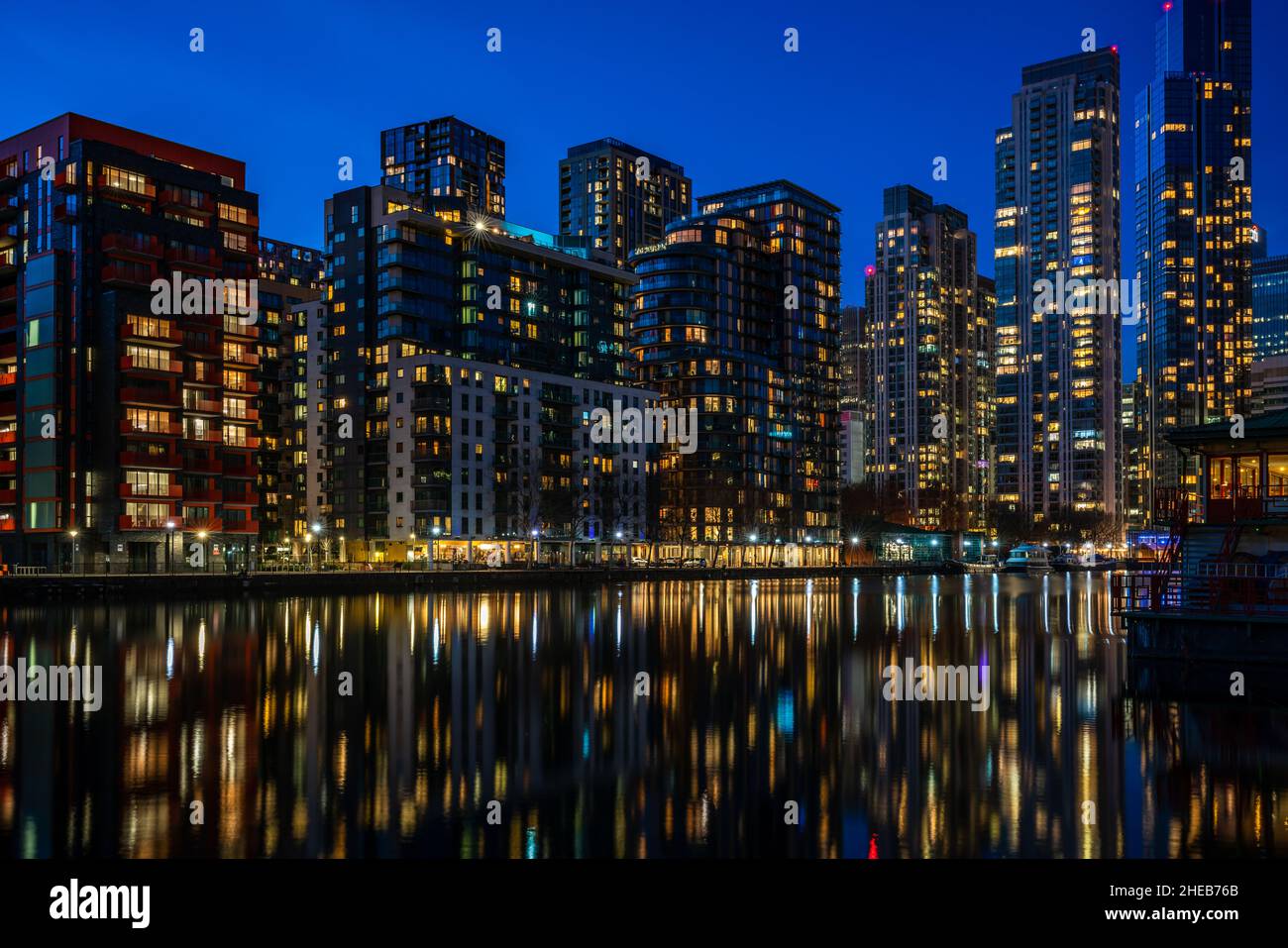 Evening view of modern skyscrapers across Millwall Inner Dock in Canary ...
