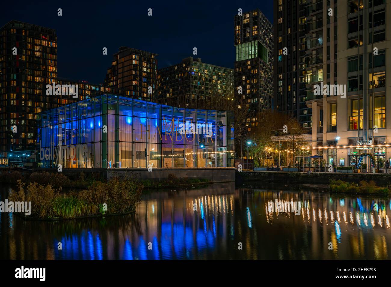 Night view of modern skyscrapers across Millwall Inner Dock in Canary ...