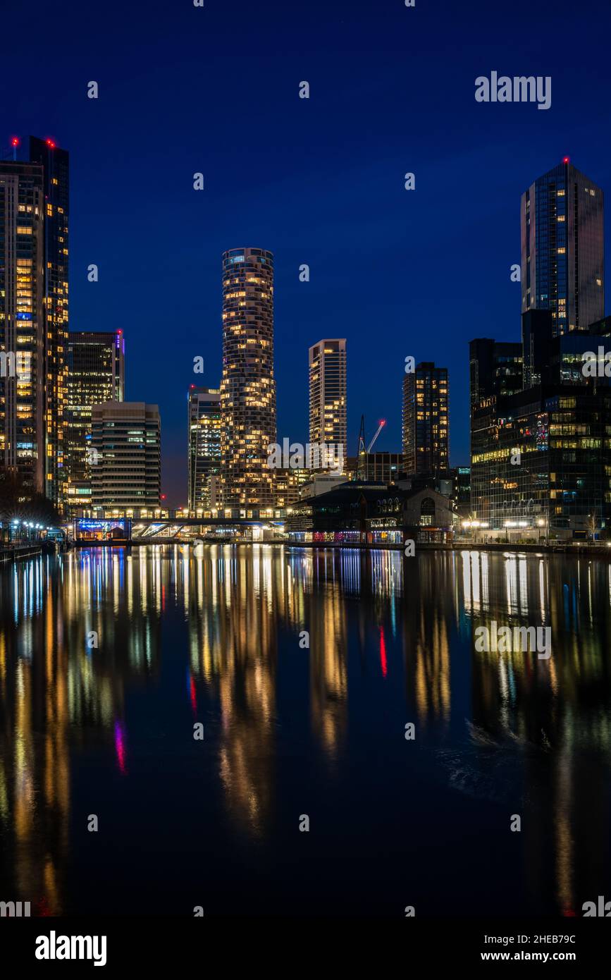 Night view of modern skyscrapers across Millwall Inner Dock in Canary ...