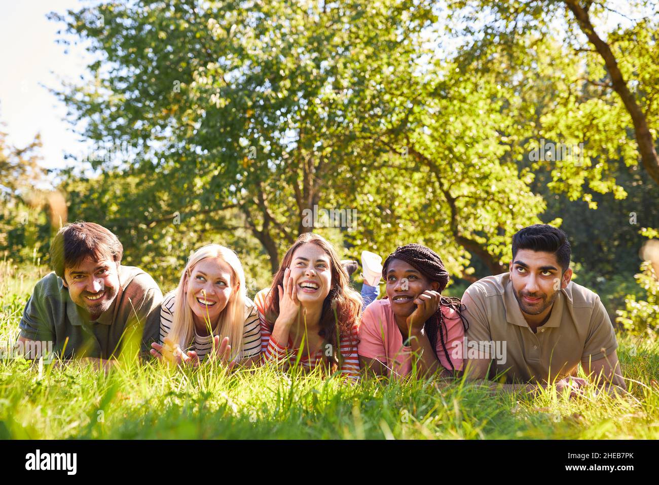 Group cheerful interracial friends hi-res stock photography and images ...