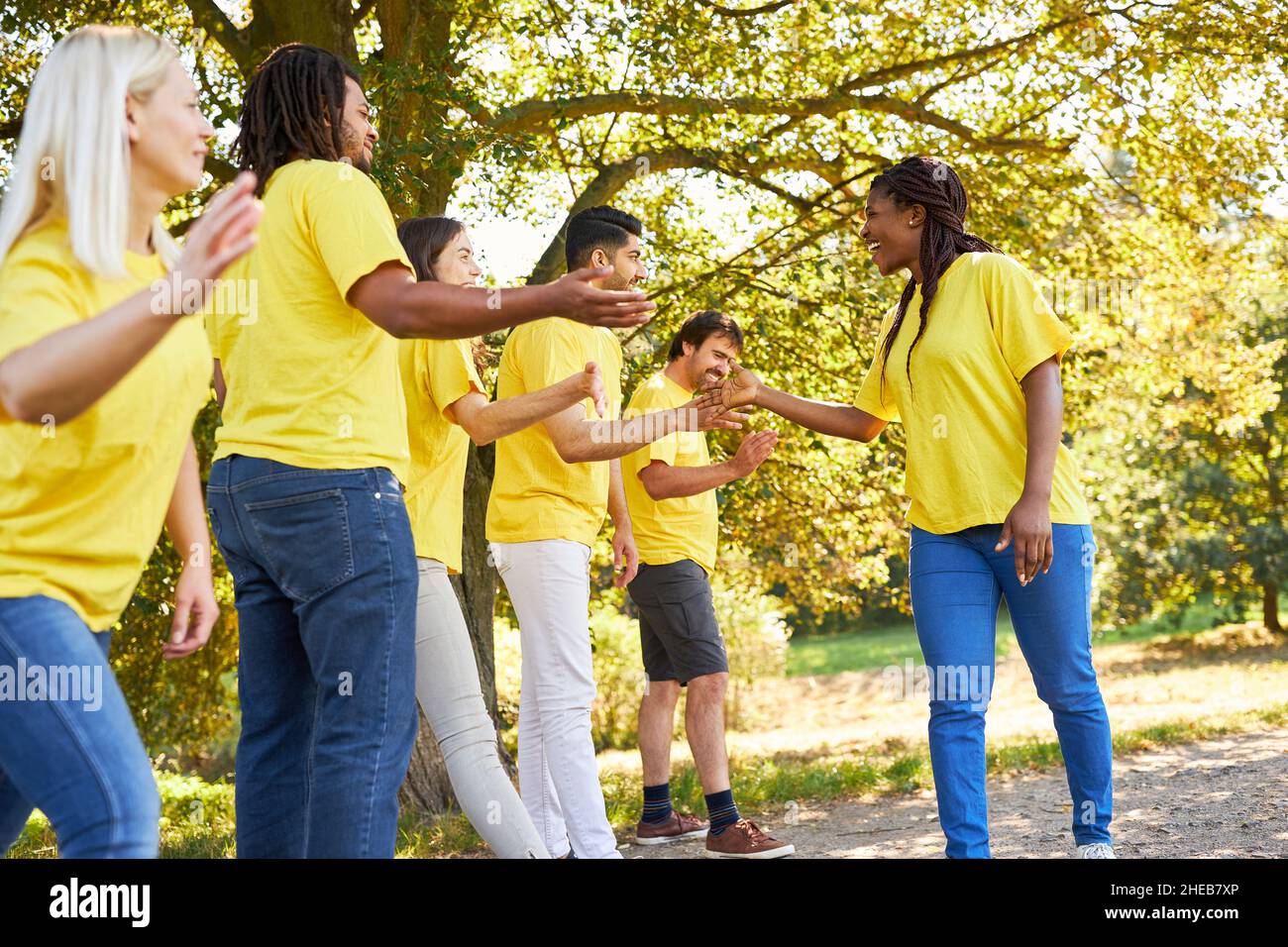 Young people as a team clapping as motivation in the team building ...