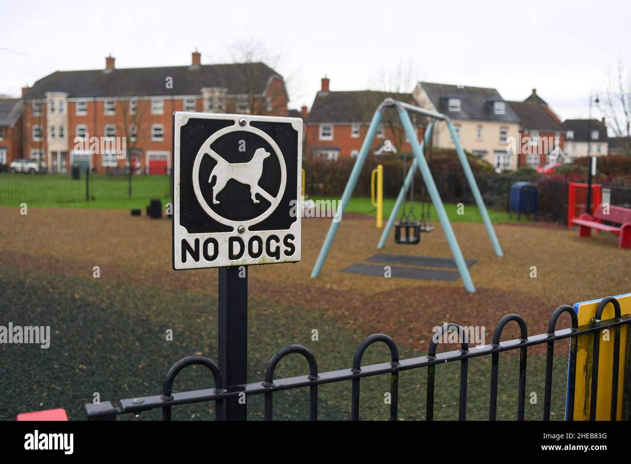 A no dogs allowed sign at a children's playground on a housing estate ...