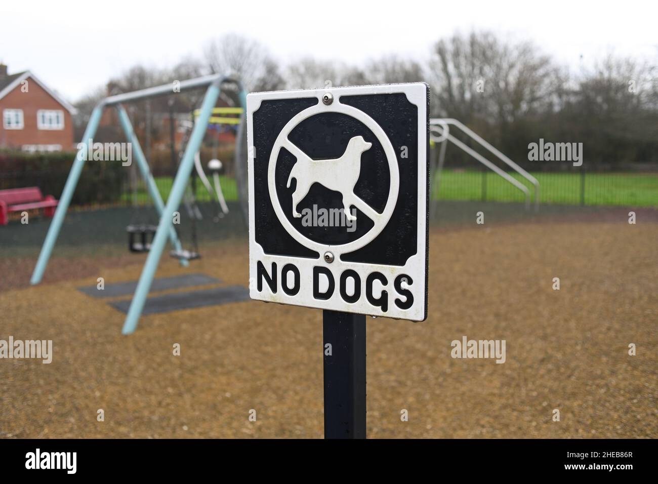 A no dogs allowed sign at a children's playground on a housing estate ...