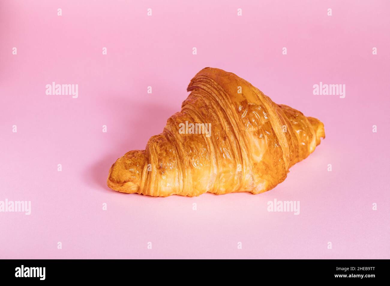 Croissant isolated on a purple background. Simple and nice concept ...