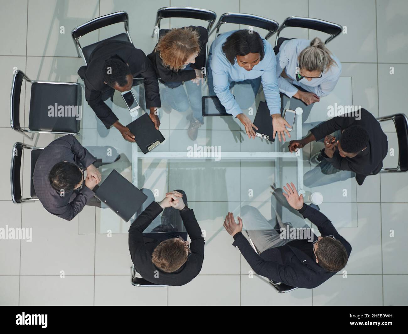 Multiracial group of young students studying together. High angl Stock ... Multiracial group of young students studying together. High angl Stock ...