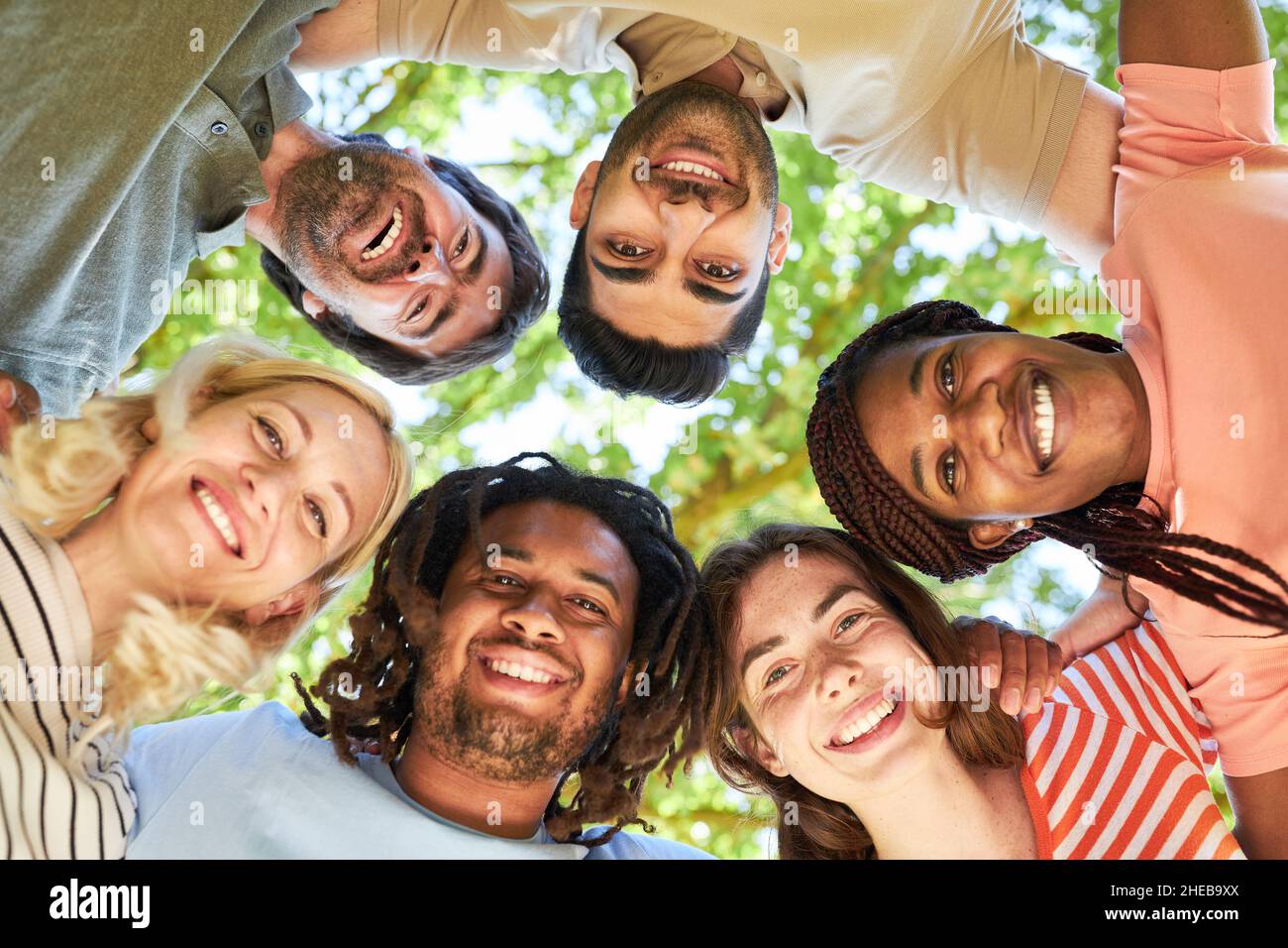 Various friends form a circle in the team building workshop for ...