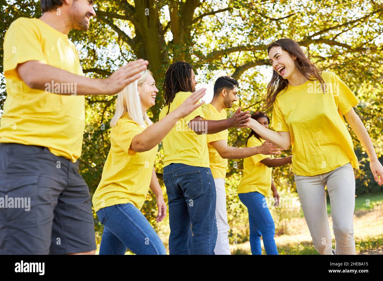 Young people as a successful team are motivated by clapping at the ...