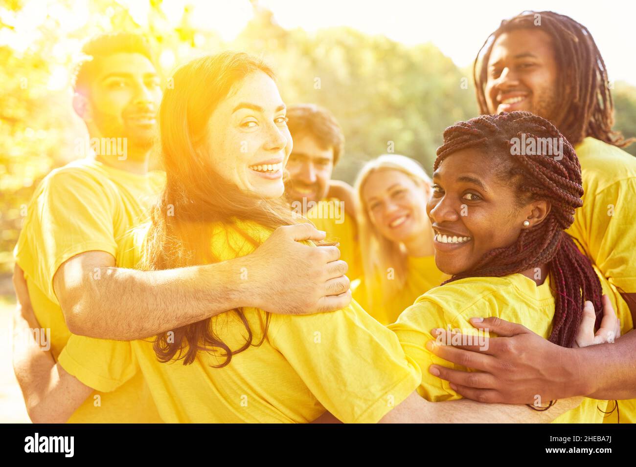 Happy multicultural squad team with hug in circle for motivation Stock ...