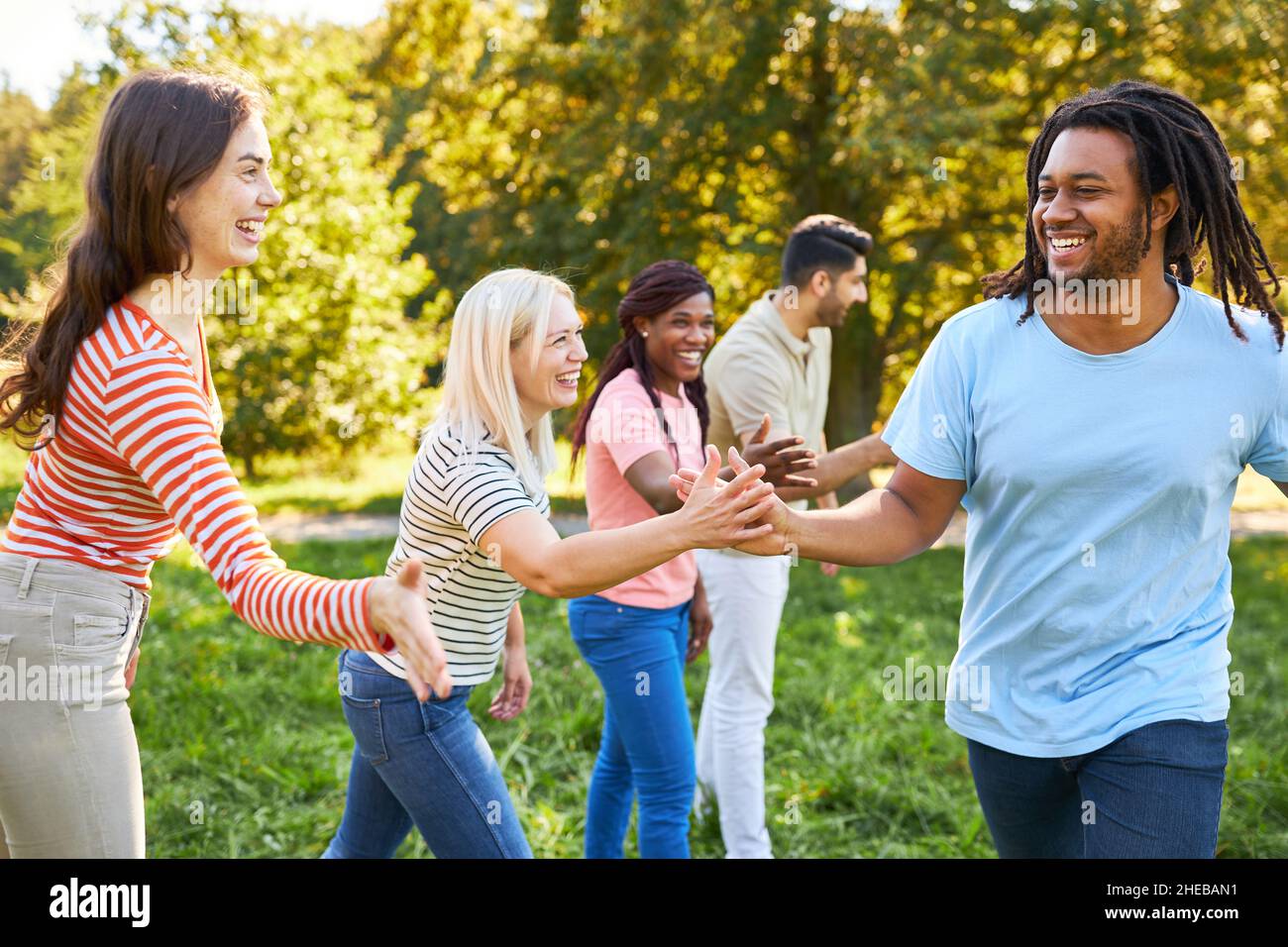 Start-up team motivates man by clapping at the race in the team ...