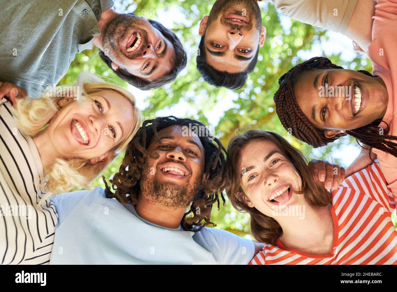 Group of friends in a circle doing a team building exercise Stock Photo ...