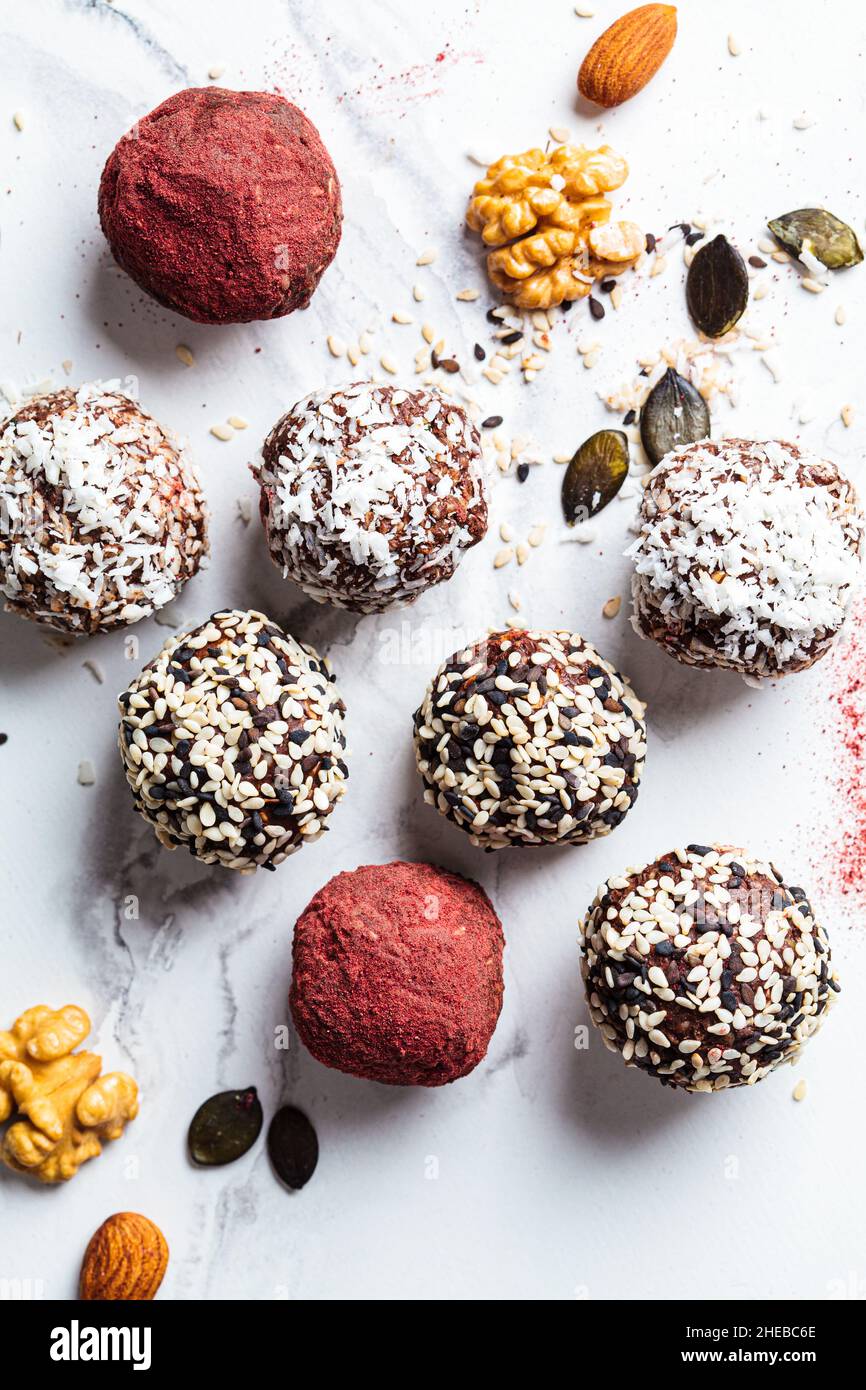 Raw vegan dessert. Energy balls. Truffles made from nuts, seeds, cocoa ...