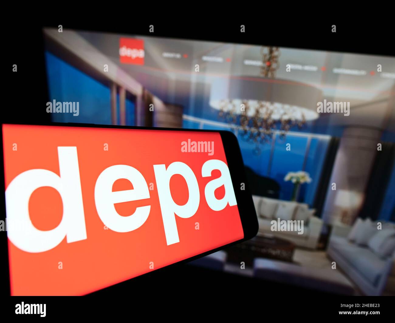 Mobile phone with logo of interior construction company Depa Plc on ...