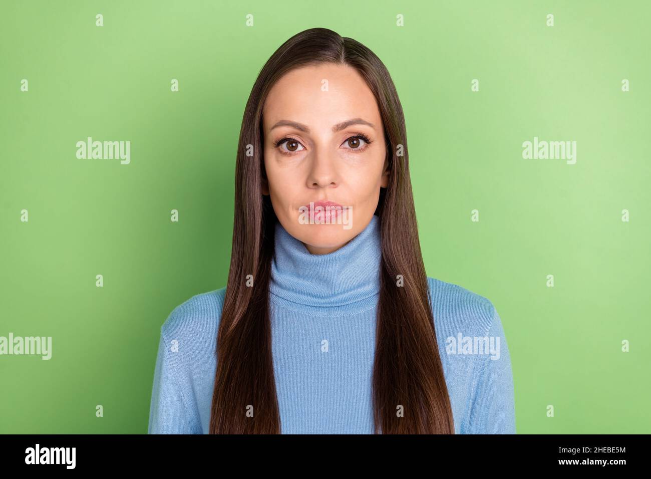 Photo of calm focused brunette lady look camera wear blue turtleneck ...