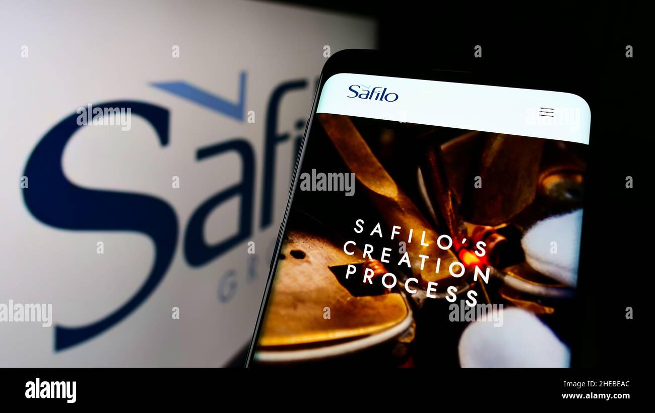 Mobile phone with webpage of Italian glasses company Safilo Group S.p.A ...