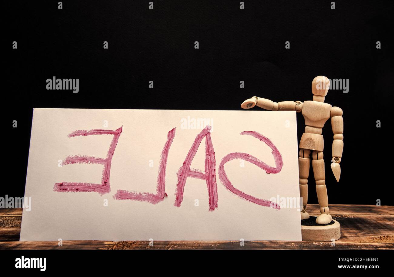 Sale. Wooden dummy and sale handwritten. Advertising sign ...