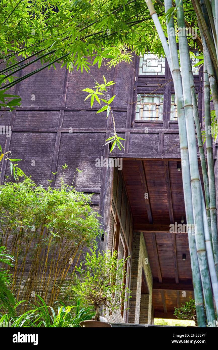 Partial closeup of an old wooden house in a Chinese bamboo forest Stock ...