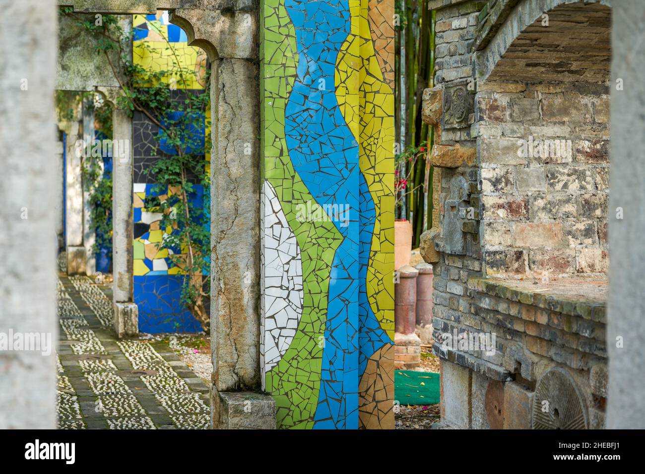 Wall and stone arches decorated with colorful broken tiles Stock Photo ...