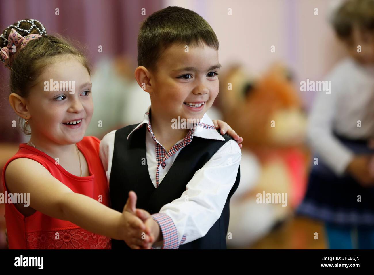 Little girl and boy dance tango Stock Photo - Alamy