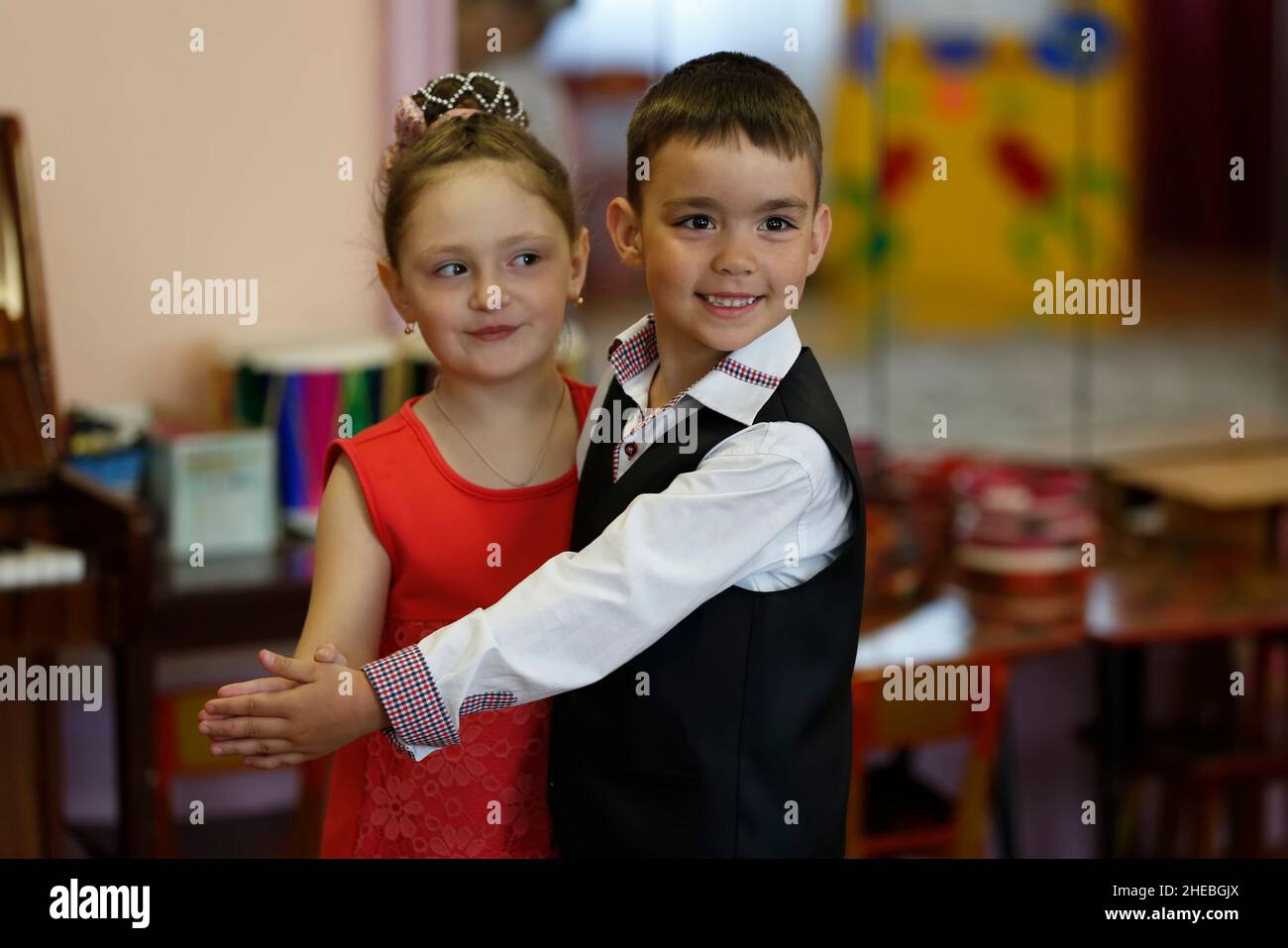 Little girl and boy dance tango Stock Photo - Alamy