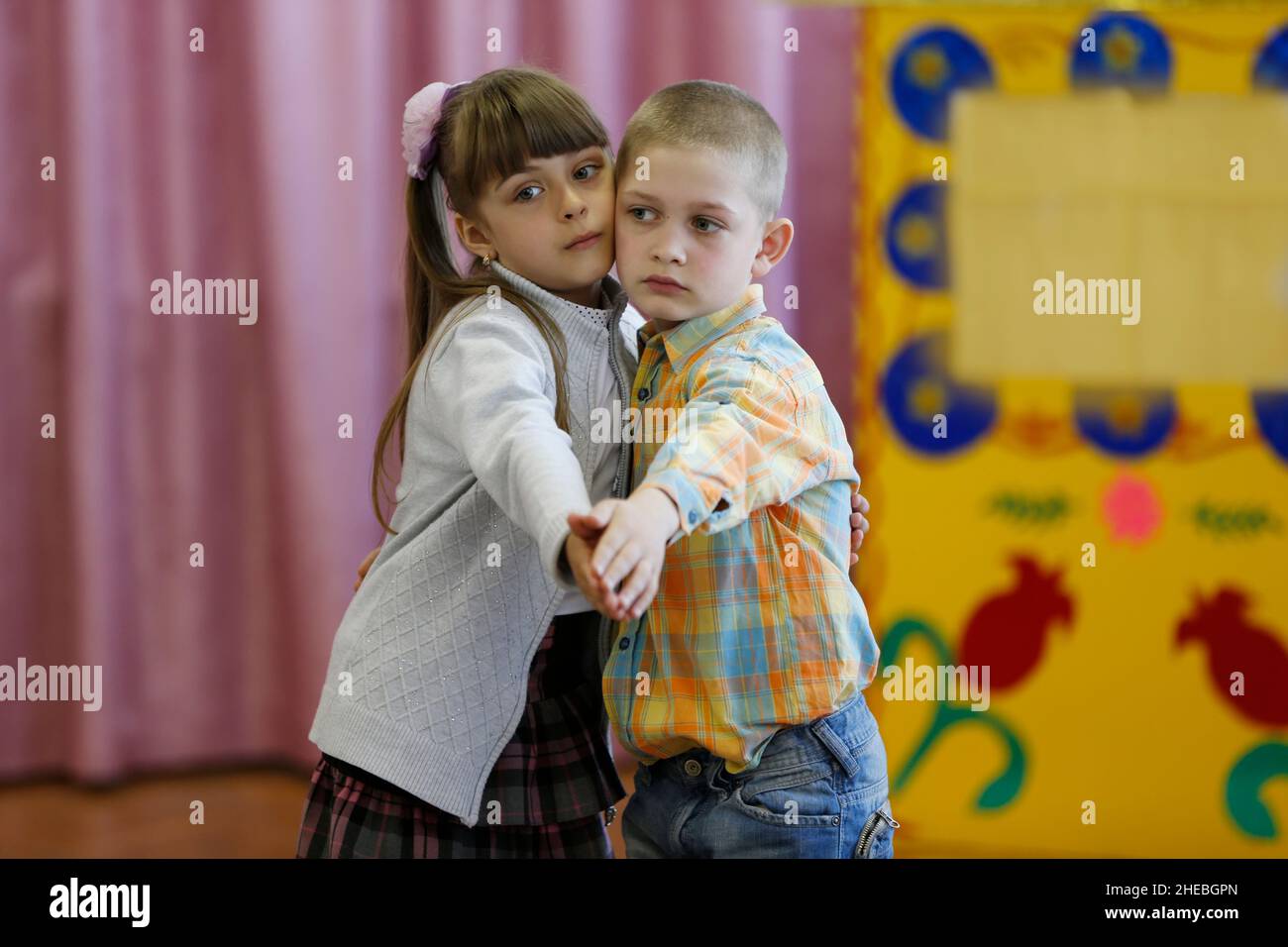 Little girl and boy dance tango Stock Photo - Alamy