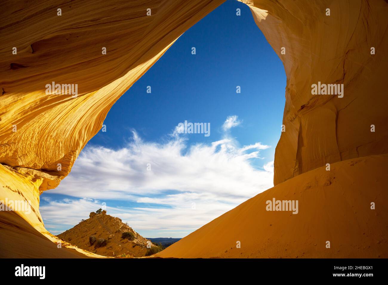 Hiker in the Great Chamber grotto, Utah, USA. Travel and journey scene ...