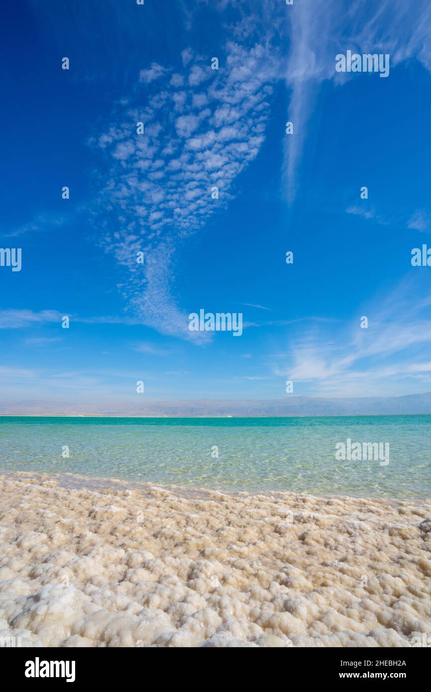 water level receding and salt crystallization due to evaporation on the ...