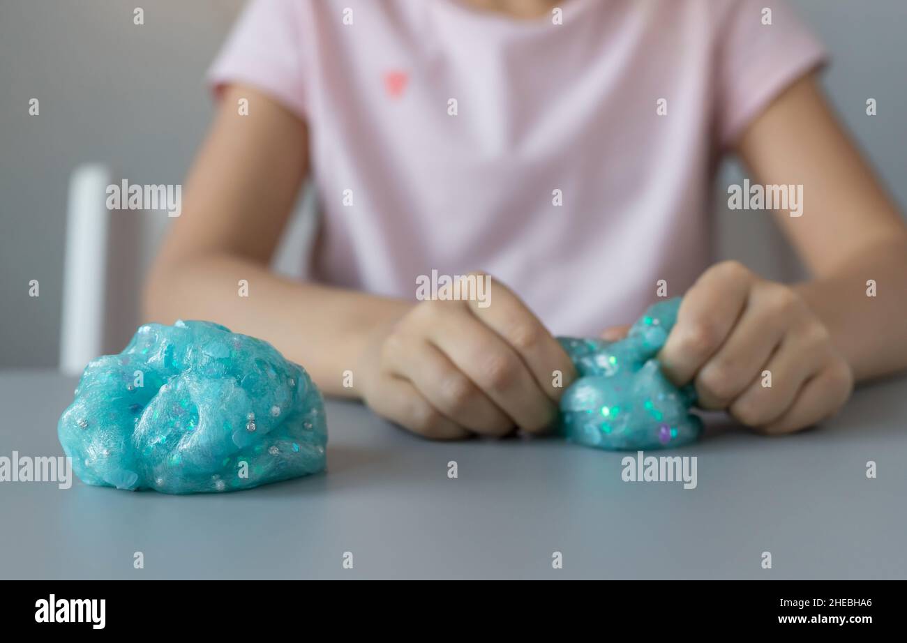 Child playing with slime hi-res stock photography and images - Alamy
