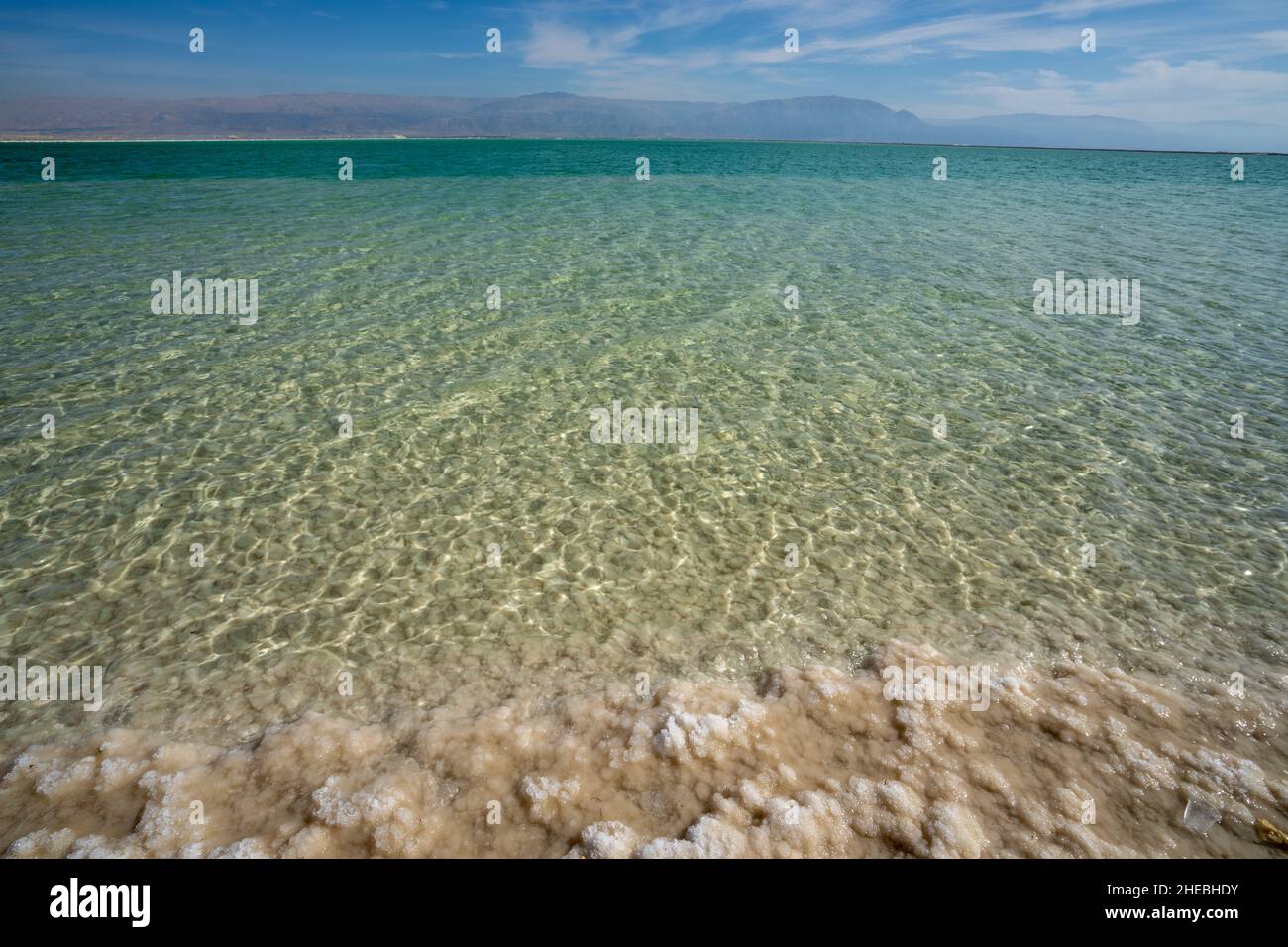 water level receding and salt crystallization due to evaporation on the ...