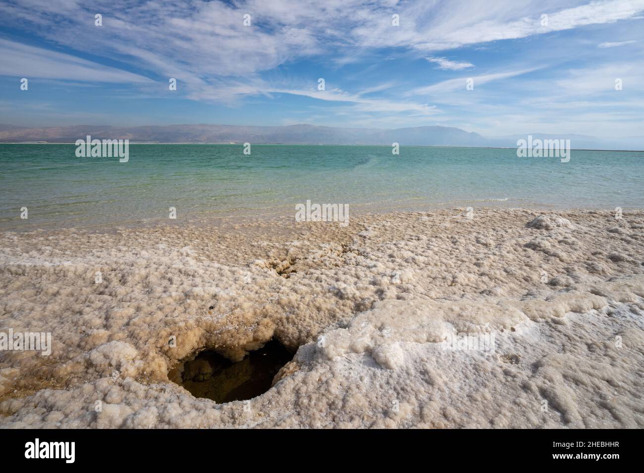 water level receding and salt crystallization due to evaporation on the ...