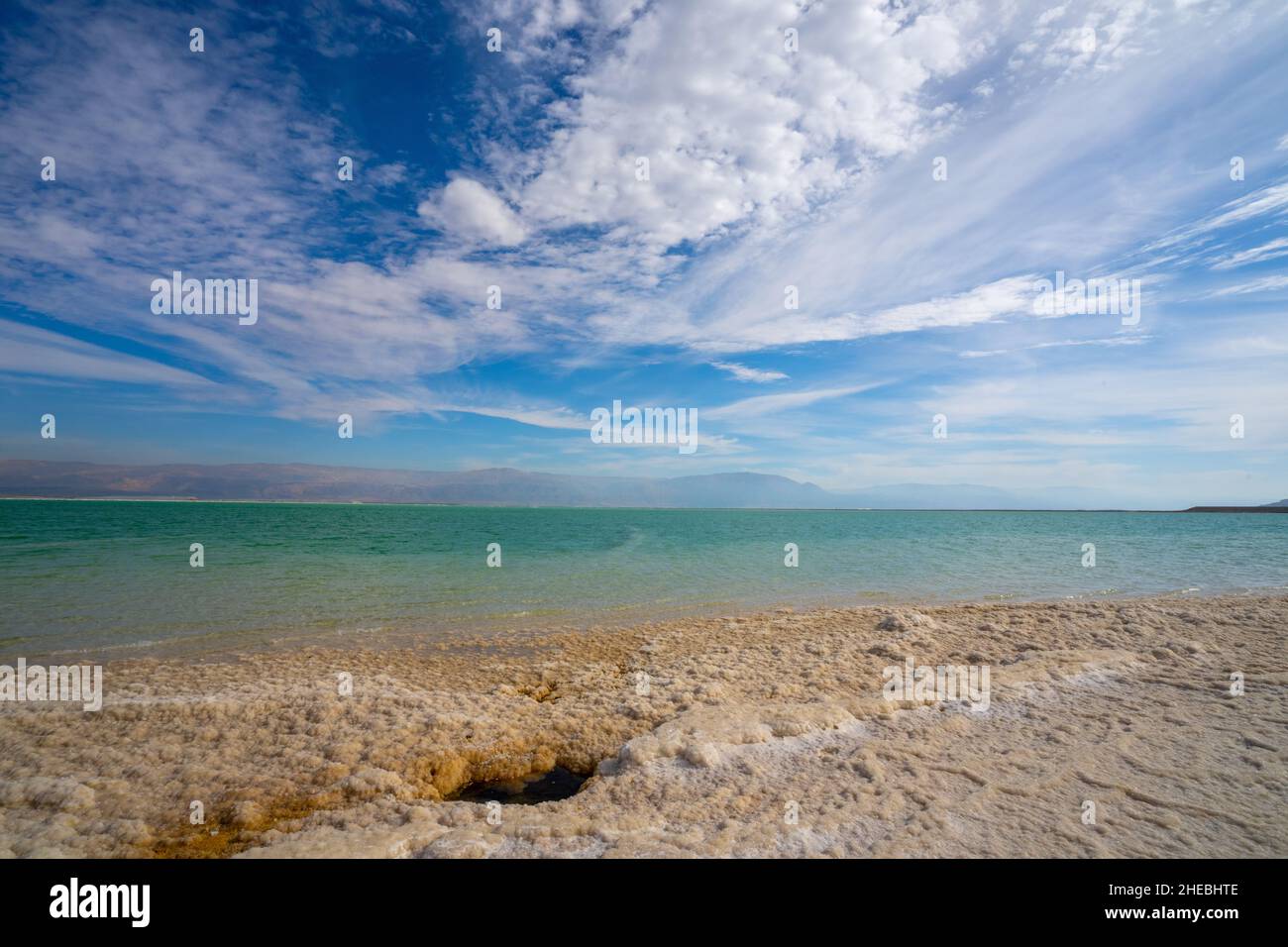 water level receding and salt crystallization due to evaporation on the ...