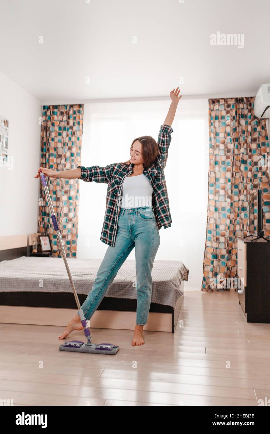 Cleaning concept. Beautiful young brunette woman doing cleaning ...