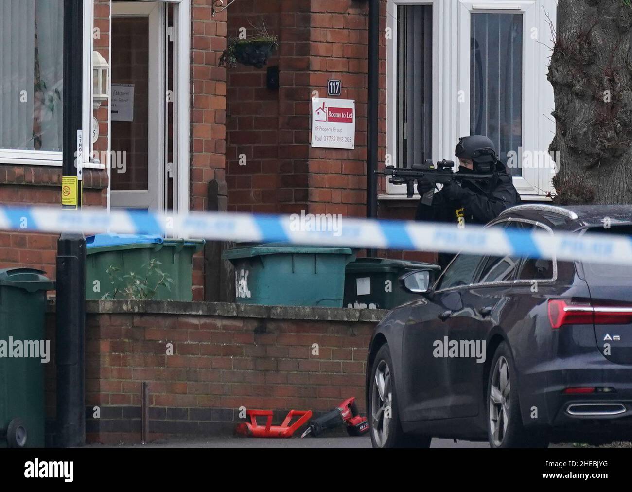 An armed police officer outside a property in Earlsdon Avenue North ...