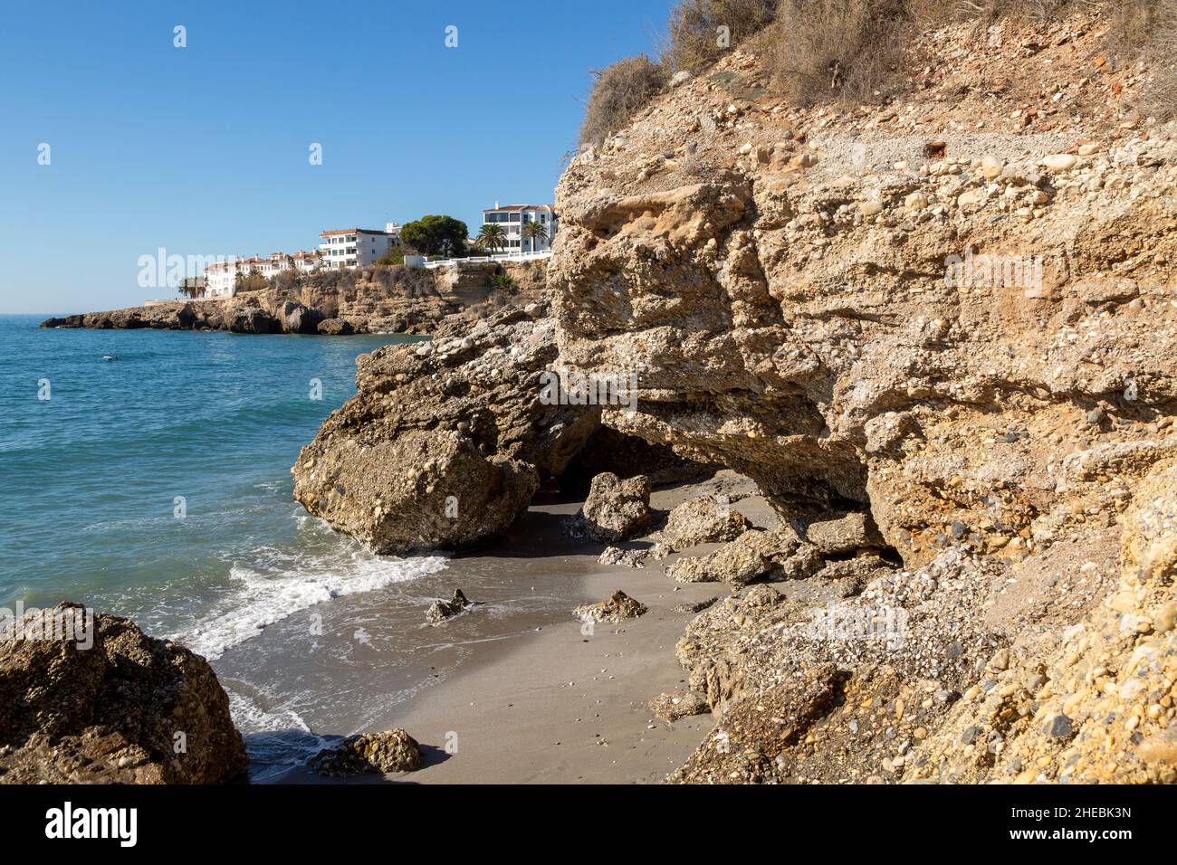 Coastal cliff composed of conglomerate sedimentary rocks at Nerja ...