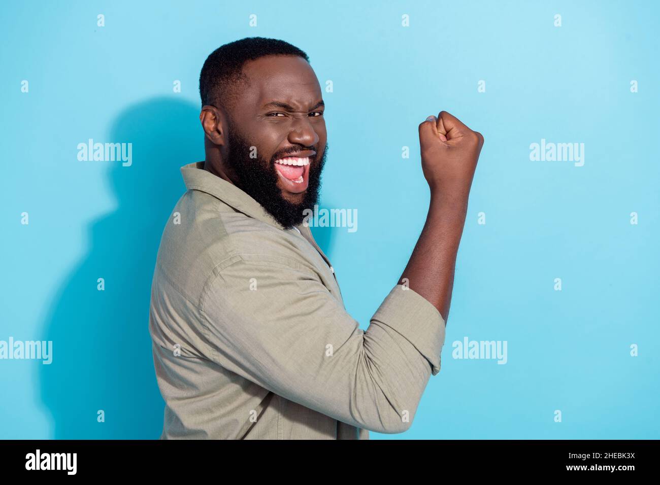 Profile side photo of young excited african man celebrate success win ...