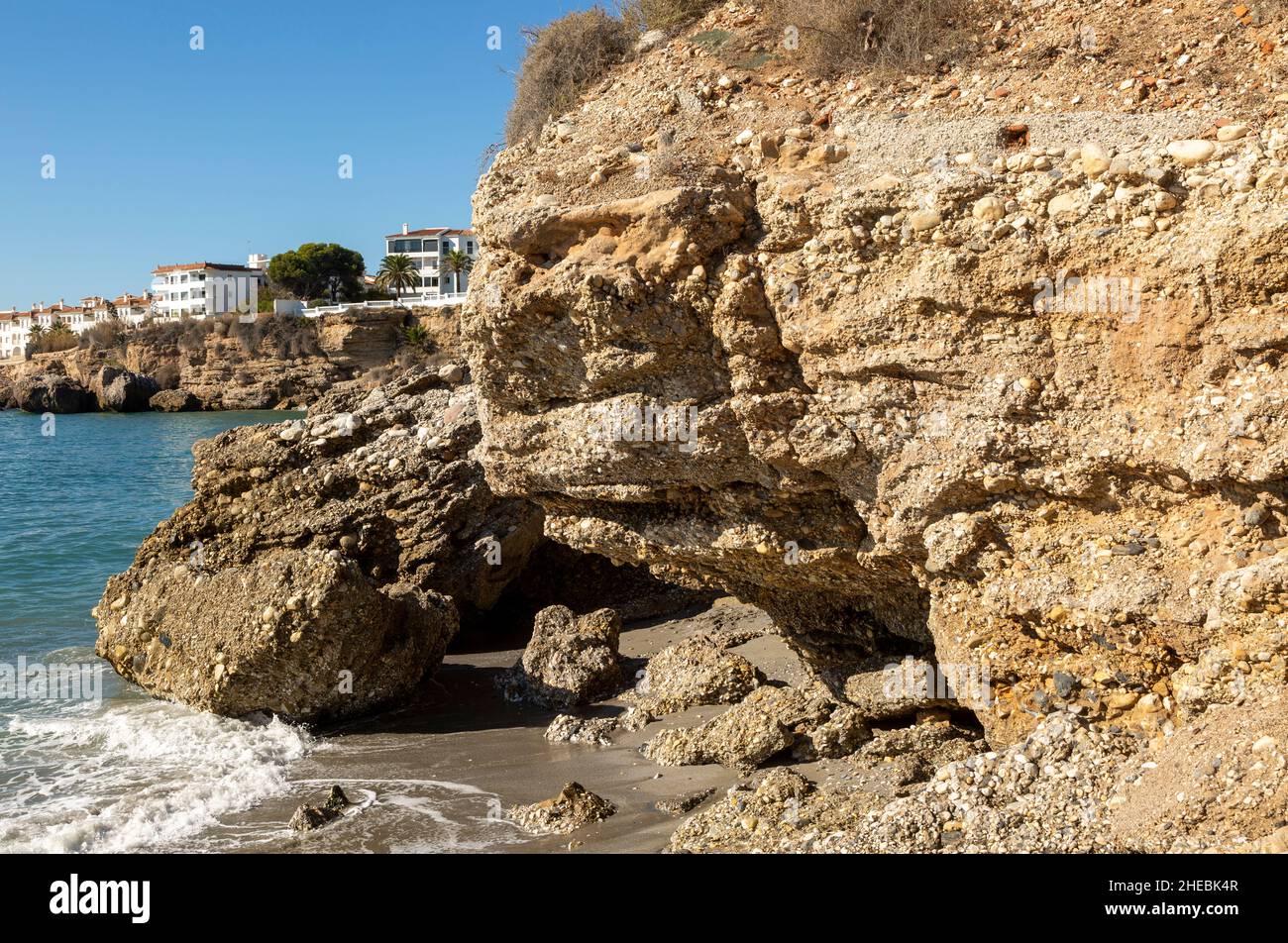 Coastal cliff composed of conglomerate sedimentary rocks at Nerja ...