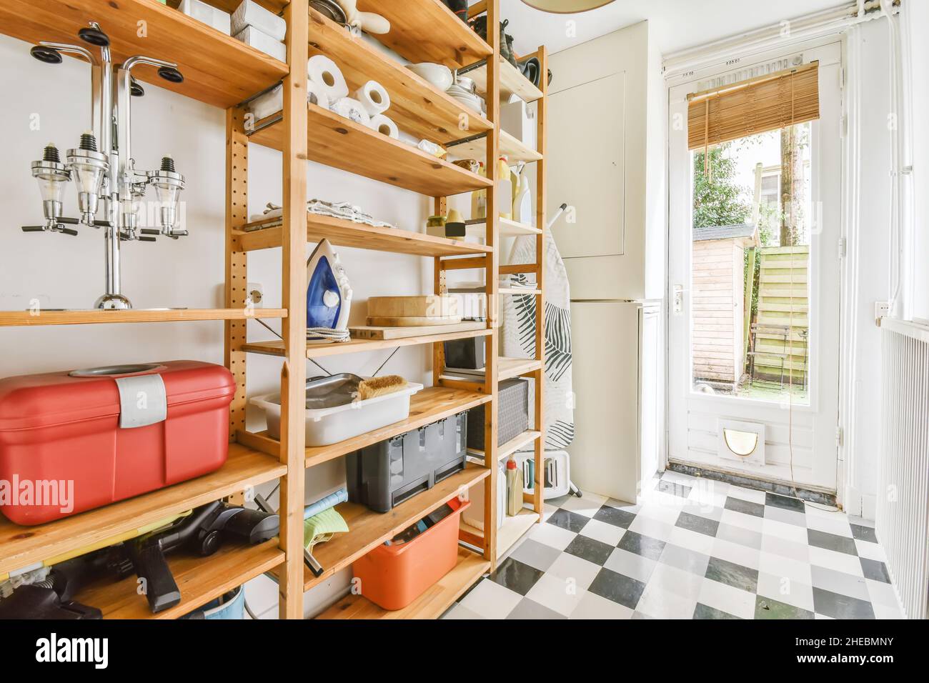 Amazing pantry with wood shelves and tile floors Stock Photo - Alamy