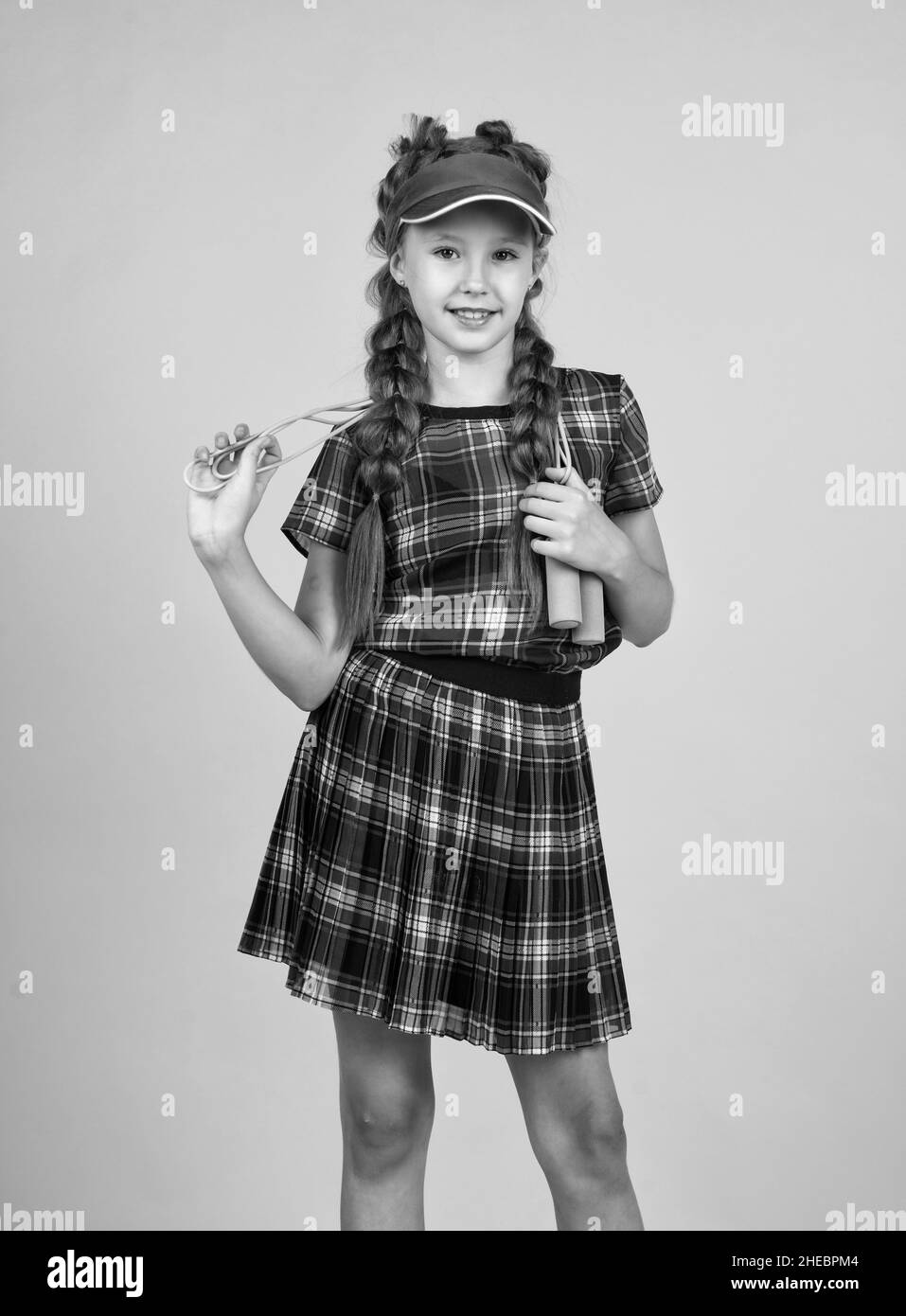 teen girl in fitness cap holding skipping rope for jumping, sport Stock ...