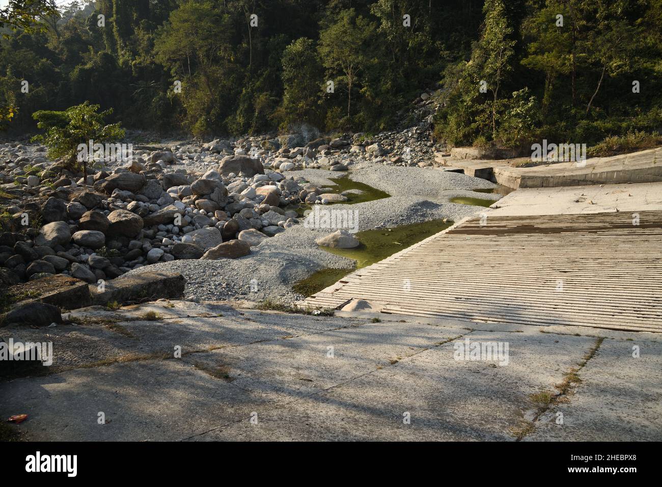 Slope after gravel separating grid of Neora dam across river Neora in ...