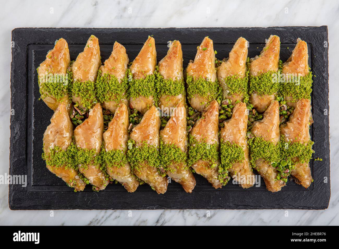 Sobiyet baklava on a marble background. Turkish patisserie dessert with ...