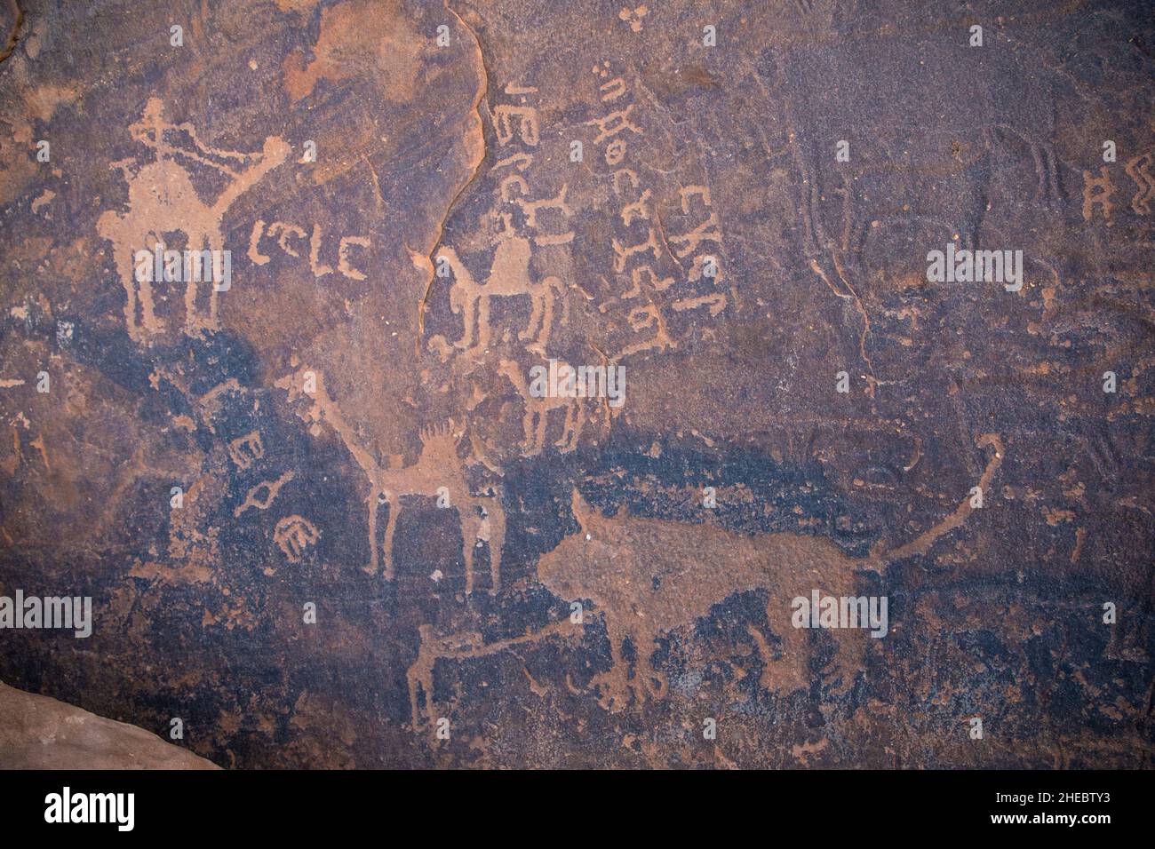ancient petroclyphs on a cave wall in Saudi Arabia Stock Photo - Alamy