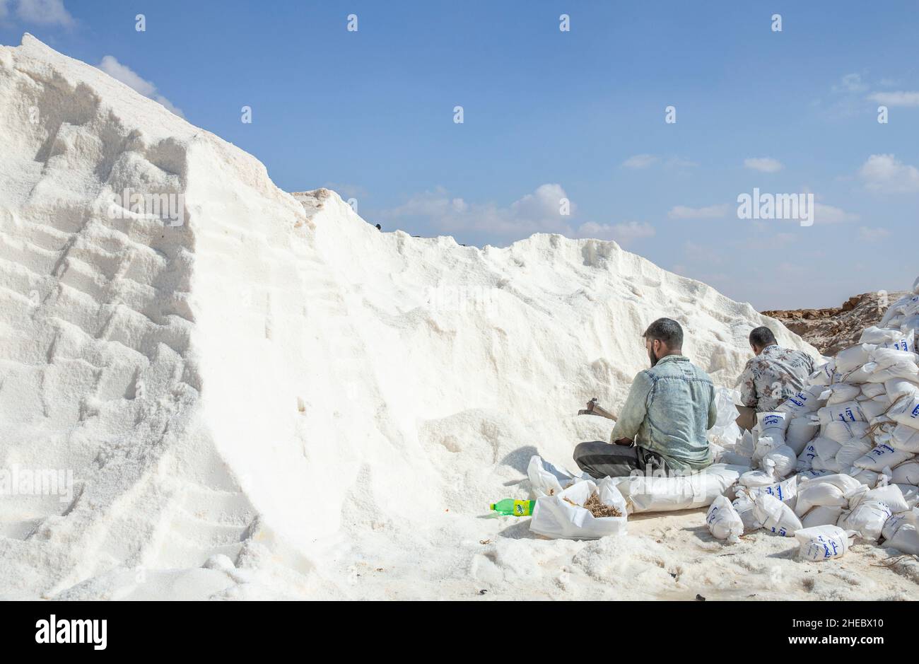 Al Hasa, Saudi Arabia, 30th December 2021: workers in a salt mine ...