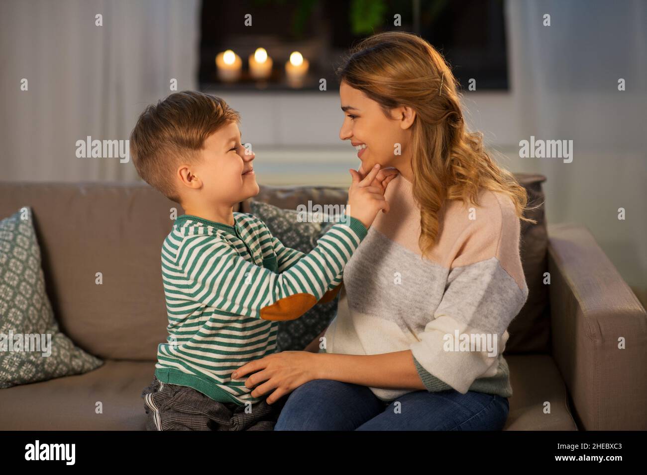 happy smiling mother talking to her son at home Stock Photo - Alamy