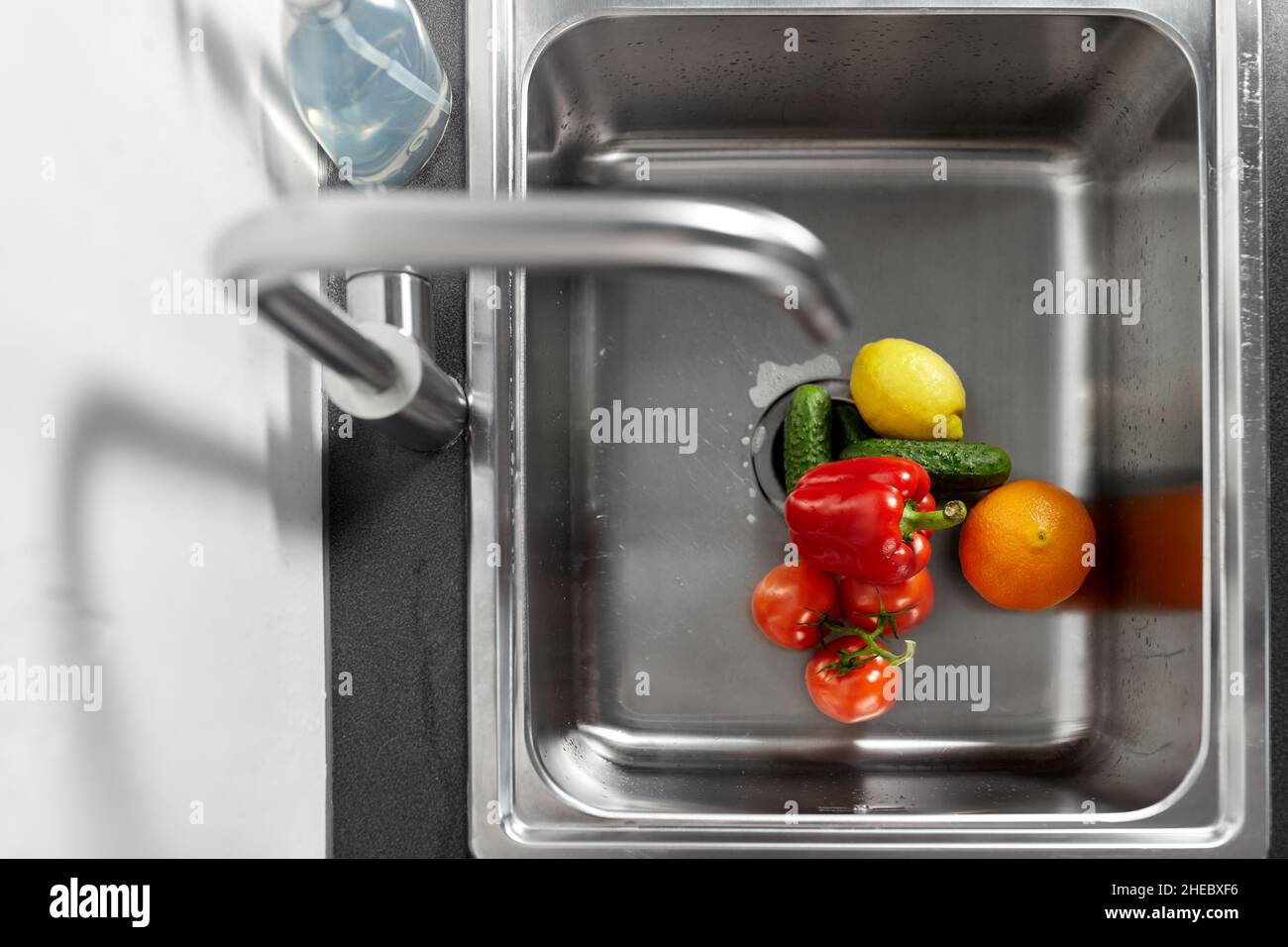 fruits and vegetables in kitchen sink Stock Photo - Alamy